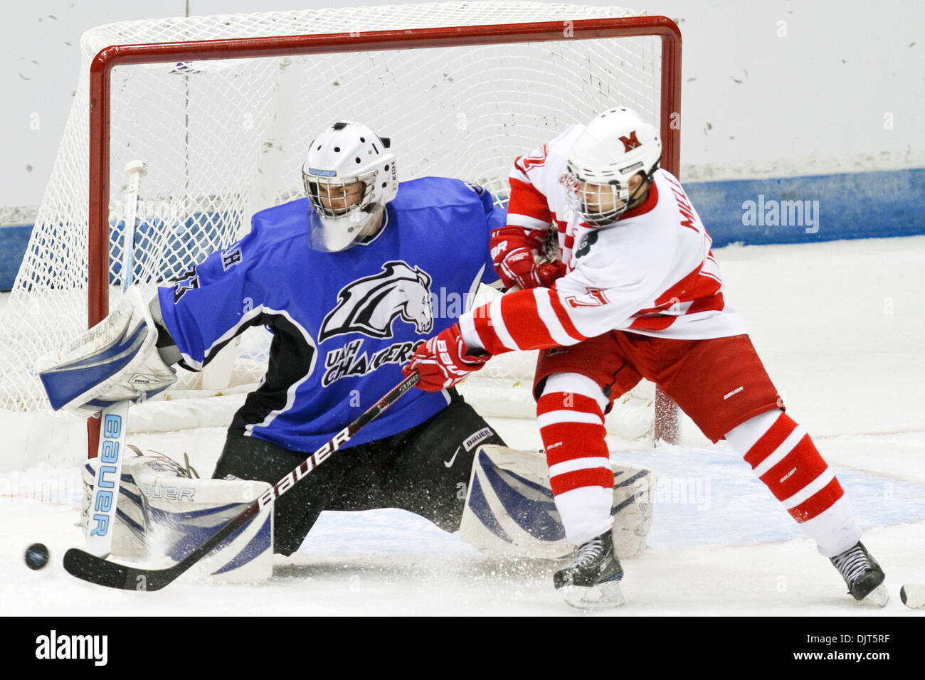 Alabama-Huntsville goalie Cameron Talbot (33) deflects a shot by Miami ...