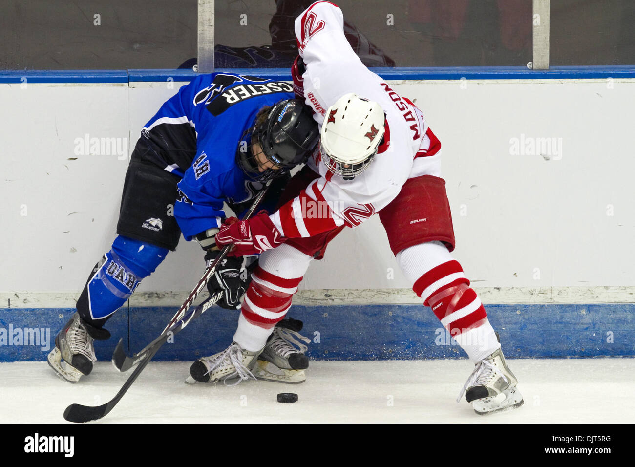 Alabama-Huntsville center Justin Cseter (26) battles Miami left winger ...