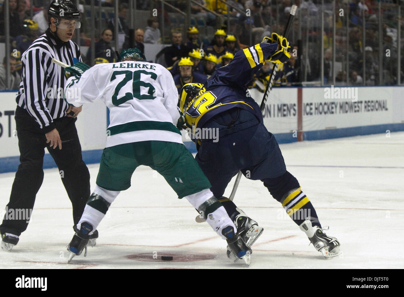 Michigan forward Carl Hagelin (12) and Bemidji State forward Tyler ...