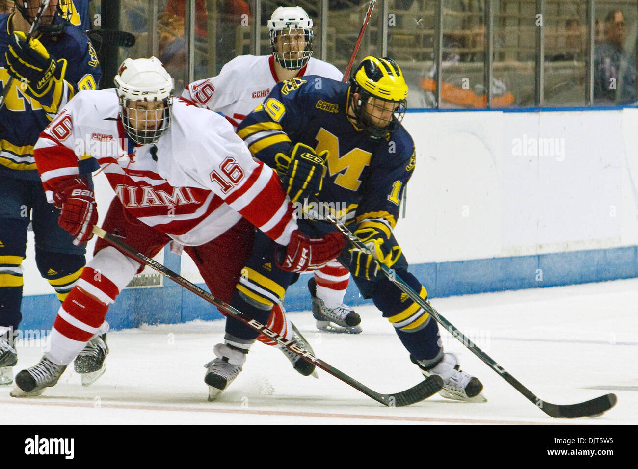 Miami forward Curtis McKenzie (16) and Michigan center Matt Rust (19 ...