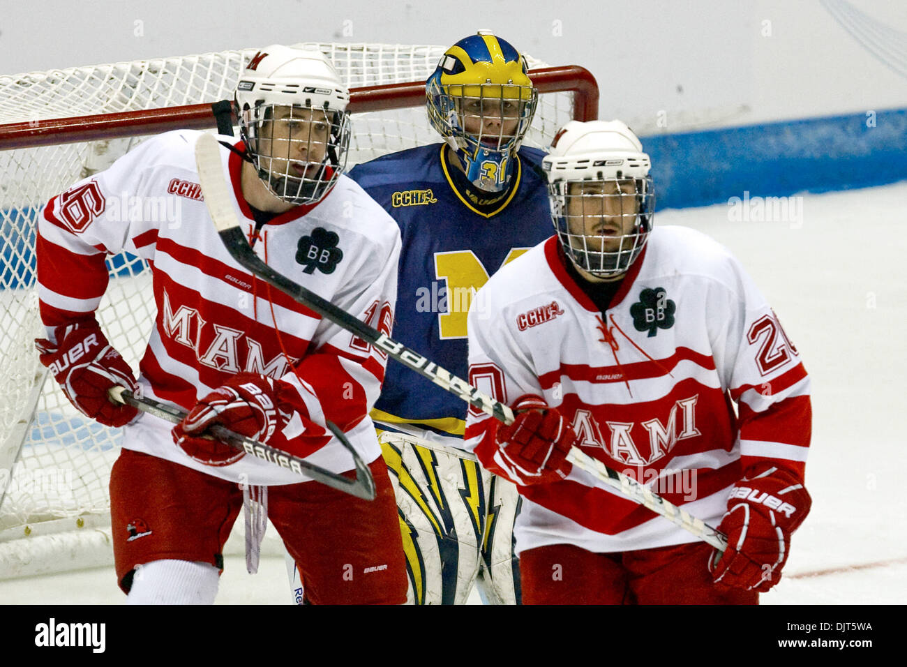 Miami center Pat Cannone (20) and forward Curtis McKenzie (16) and ...