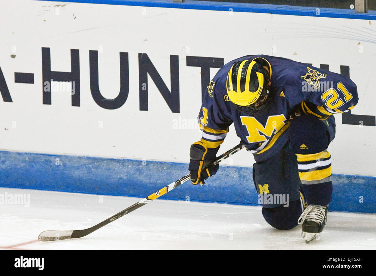 Michigan center AJ Treais (21) reflects on his team's loss in overtime ...