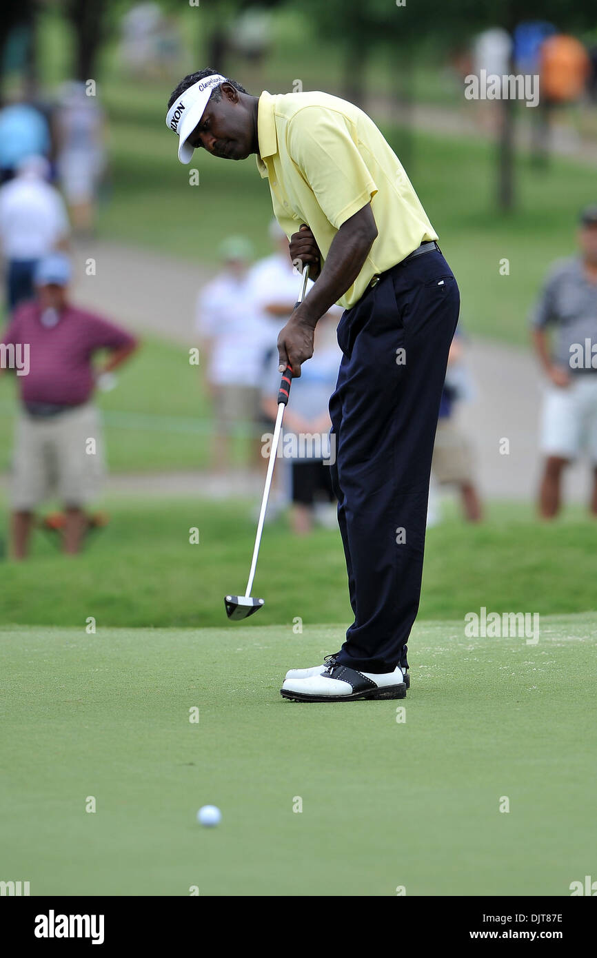 Vijay Singh putting on the green during the HP Byron Nelson ...