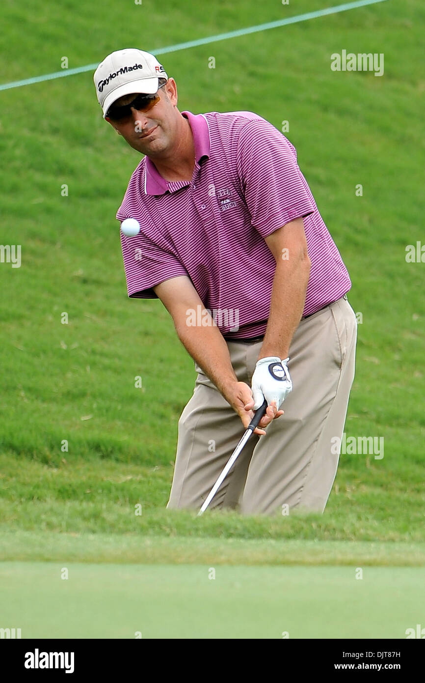 Jeff Grove chips on to green during the HP Byron Nelson Championship at ...