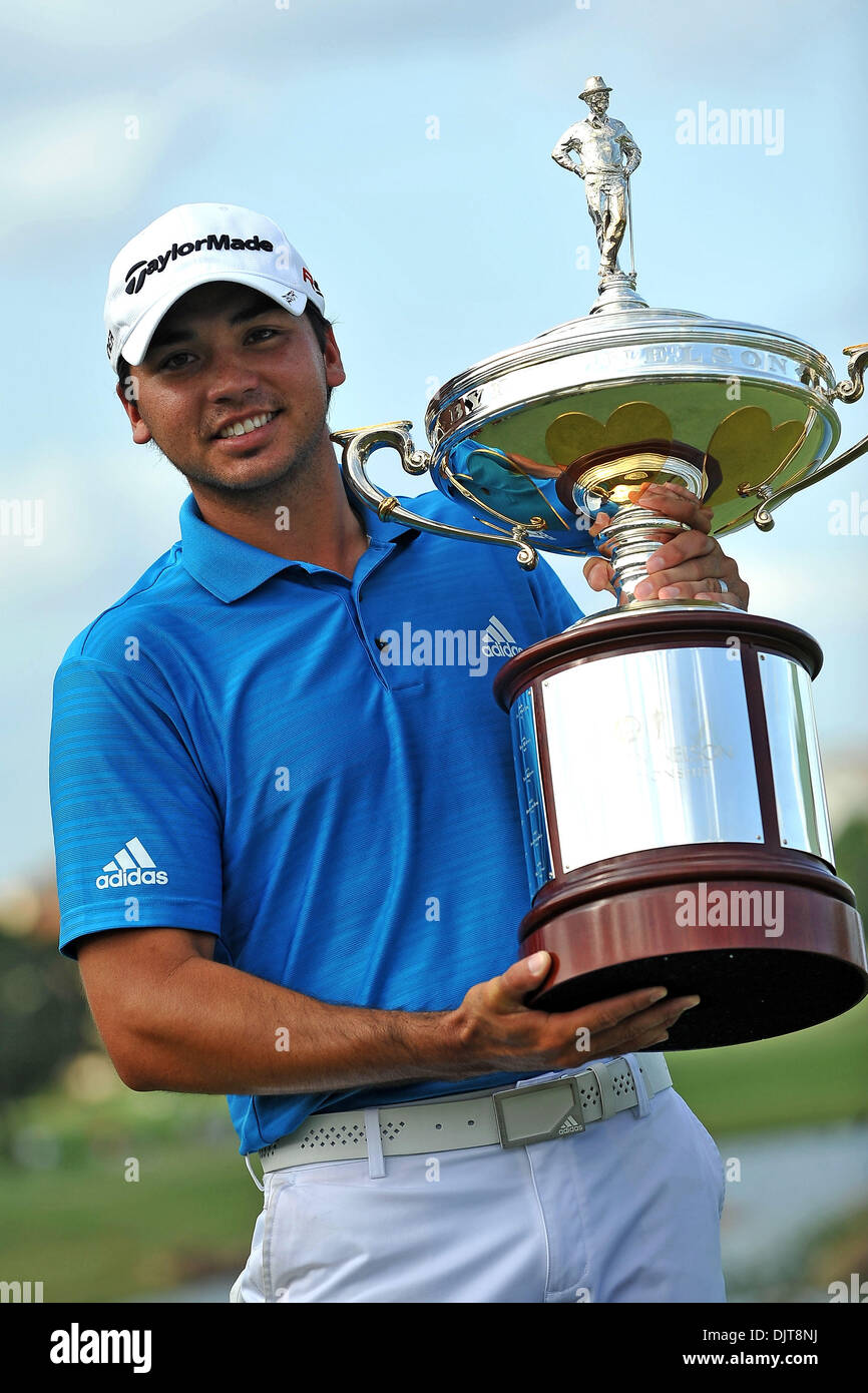 Jason Day celebrates his first US PGA Tour win while holding the trophy ...