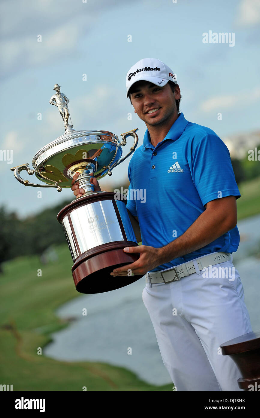 Jason Day celebrates his first US PGA Tour win while holding the trophy ...