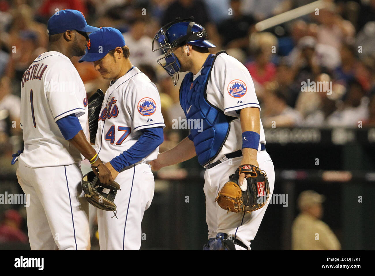 At the mound Mets Pitcher Hisanori Takahashi (#47), Infielder Luis ...