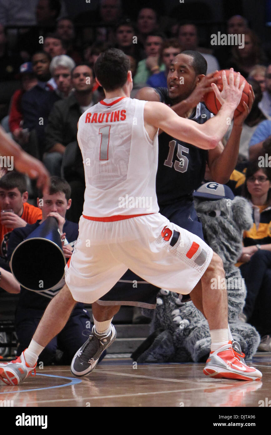Georgetown guard Austin Freeman #15 looks for an outlet from Syracuse ...
