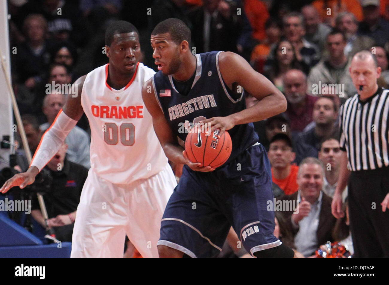 Georgetown center Greg Monroe #10 watches for opportunity around ...