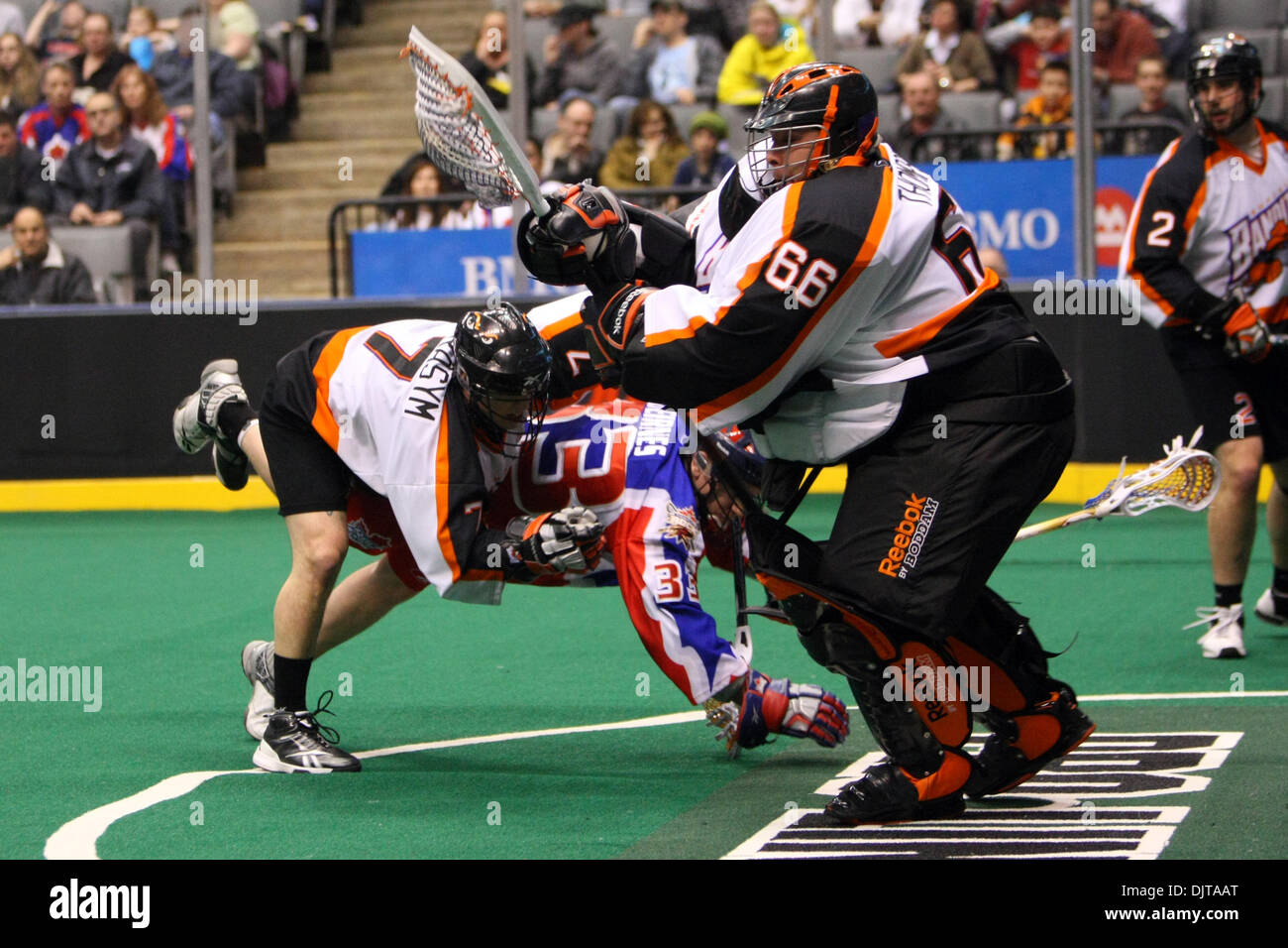 Buffalo Bandits goalie Michael Thompson (66) saves a goal as Toronto ...