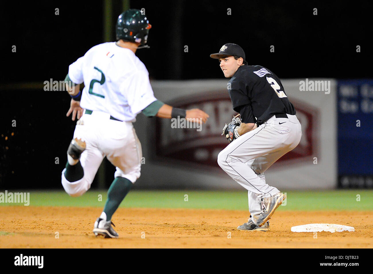 Wake Forest Demon Deacons 2nd baseman Mark Rhine turns double play. The ...