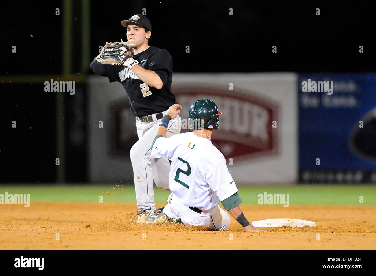 Wake Forest Demon Deacons 2nd baseman Mark Rhine turns double play. The ...
