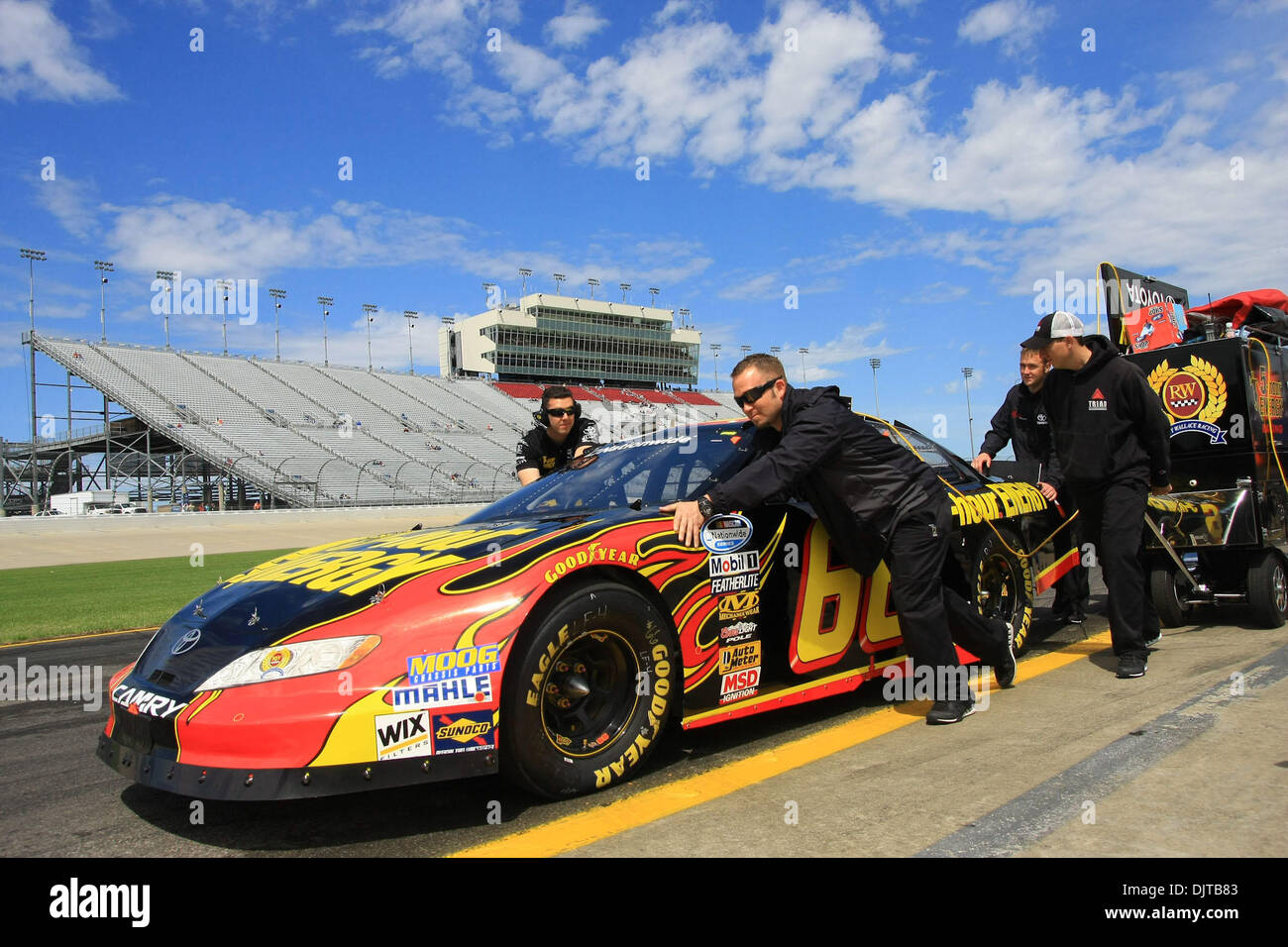 The (66) 5 Hour Energy crew moves the car up in line during qualifying ...