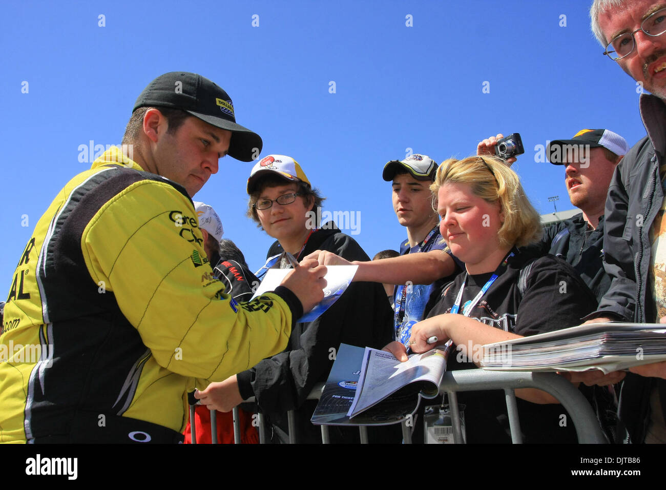 Reed Sorenson of the Dollar General car signs autographs for fans ...