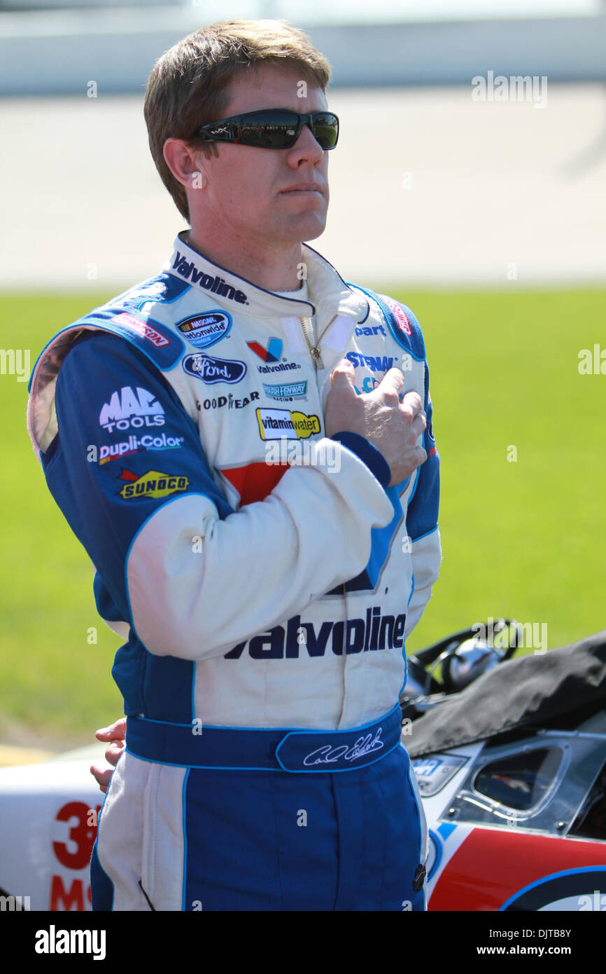 Carl Edwards recognizes the flag during the National Anthem before the ...