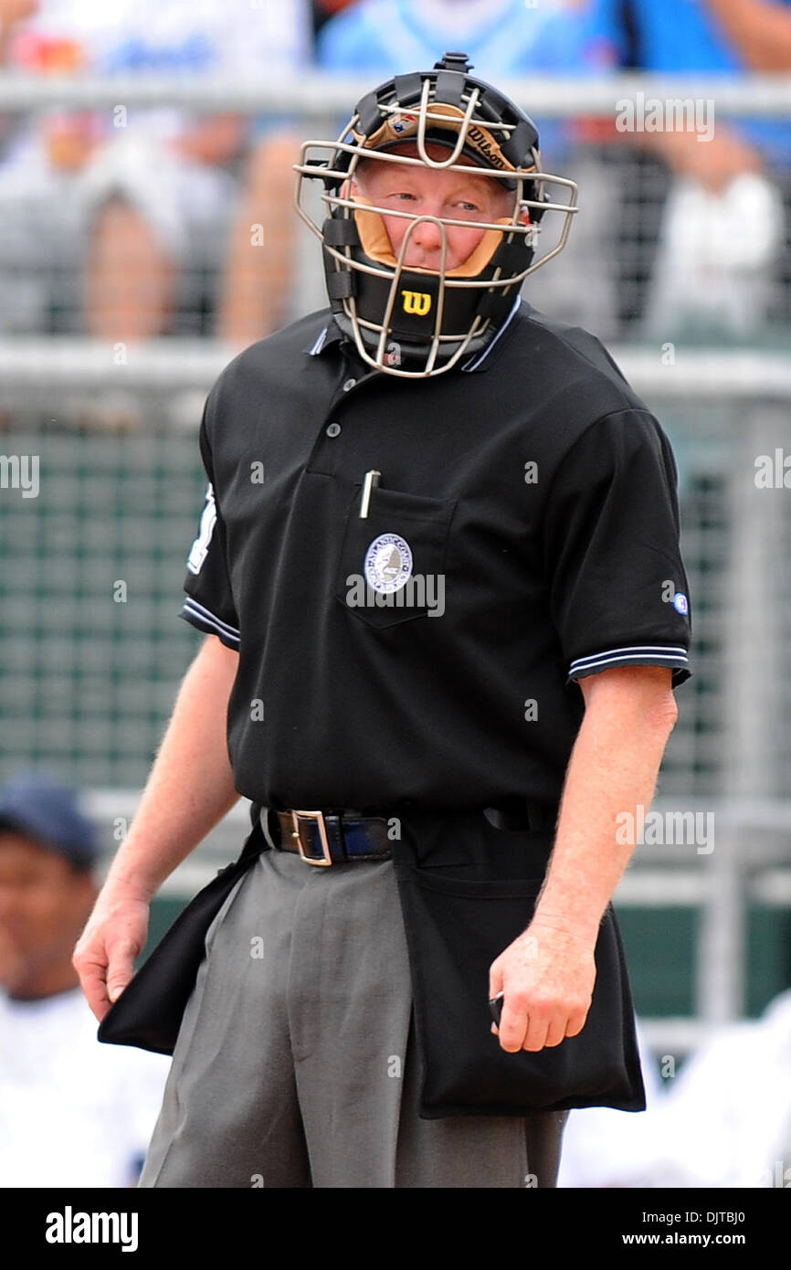 Home plate umpire glares at the North Carolina Tar Heels dugout. The ...