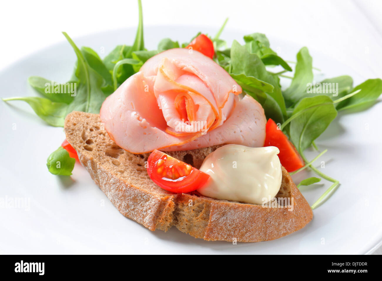 Bread with ham and salad greens Stock Photo - Alamy