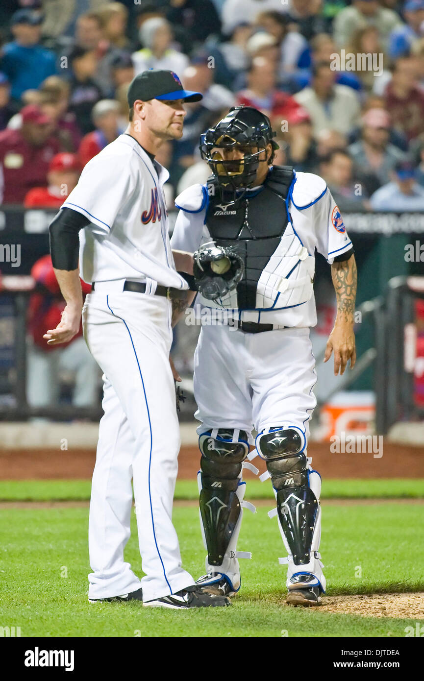 Mets starting pitcher Mike Pelfrey #34 talks with catcher Henry Blanco ...