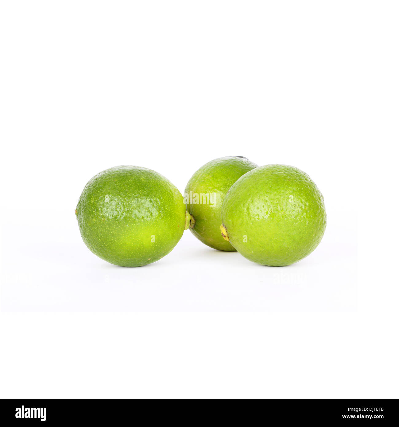 Three limes closeup on white background Stock Photo - Alamy