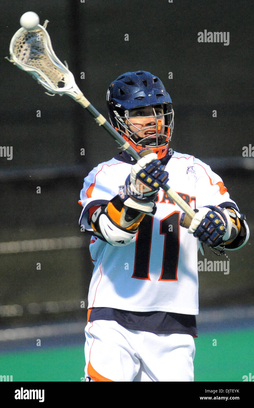 Hobart attackman Kevin Curtin (11) makes the pass from behind the ...