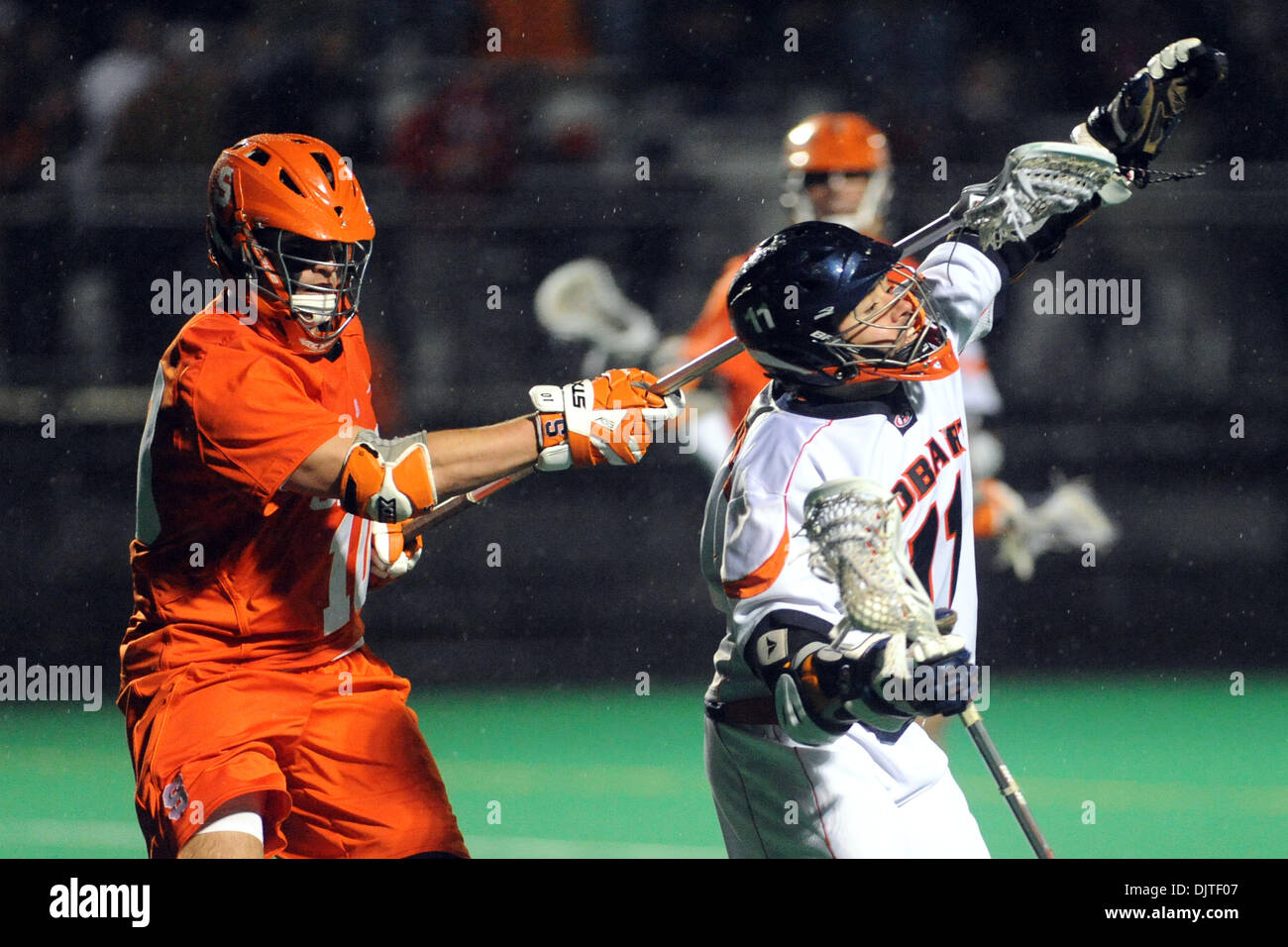 Hobart attackman Kevin Curtin (11) takes the stick to the head in the ...