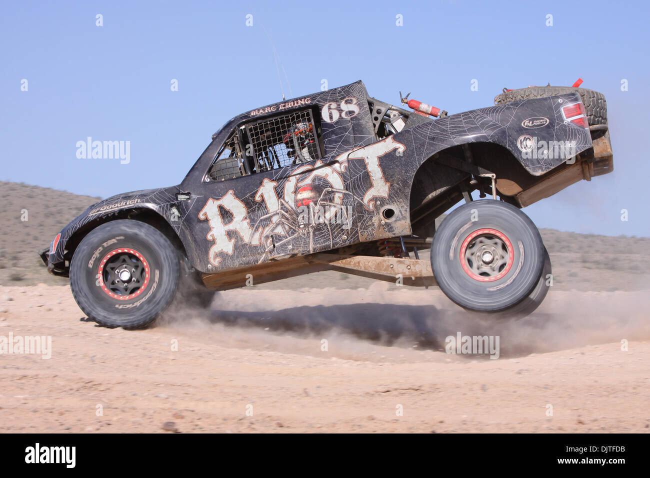 March 27, 2010 Marc Ewing(#68) lands his Trophy Truck from a big jump ...