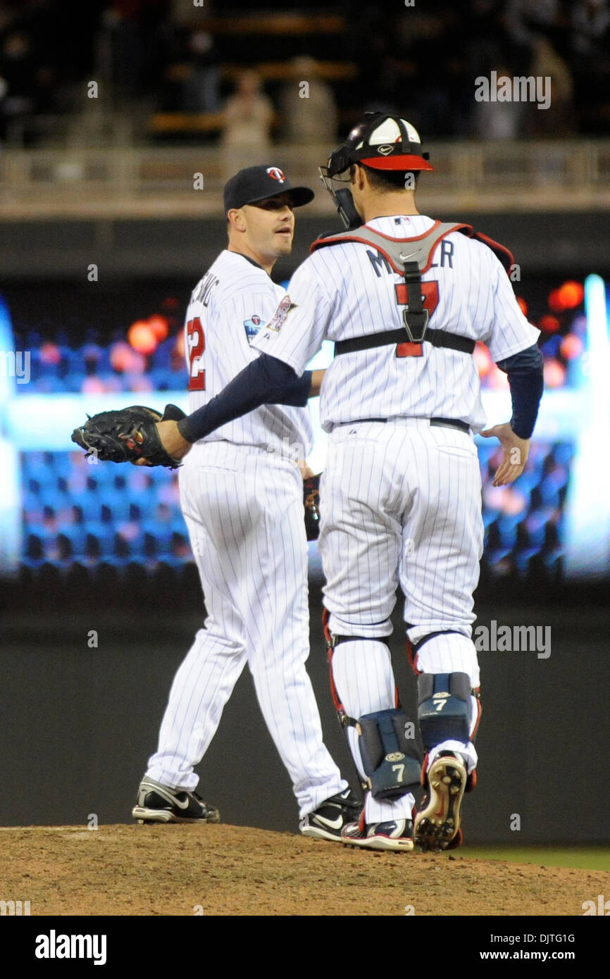 Minnesota Twins relief pitcher Brian Duensing #52 and catcher Joe Mauer ...