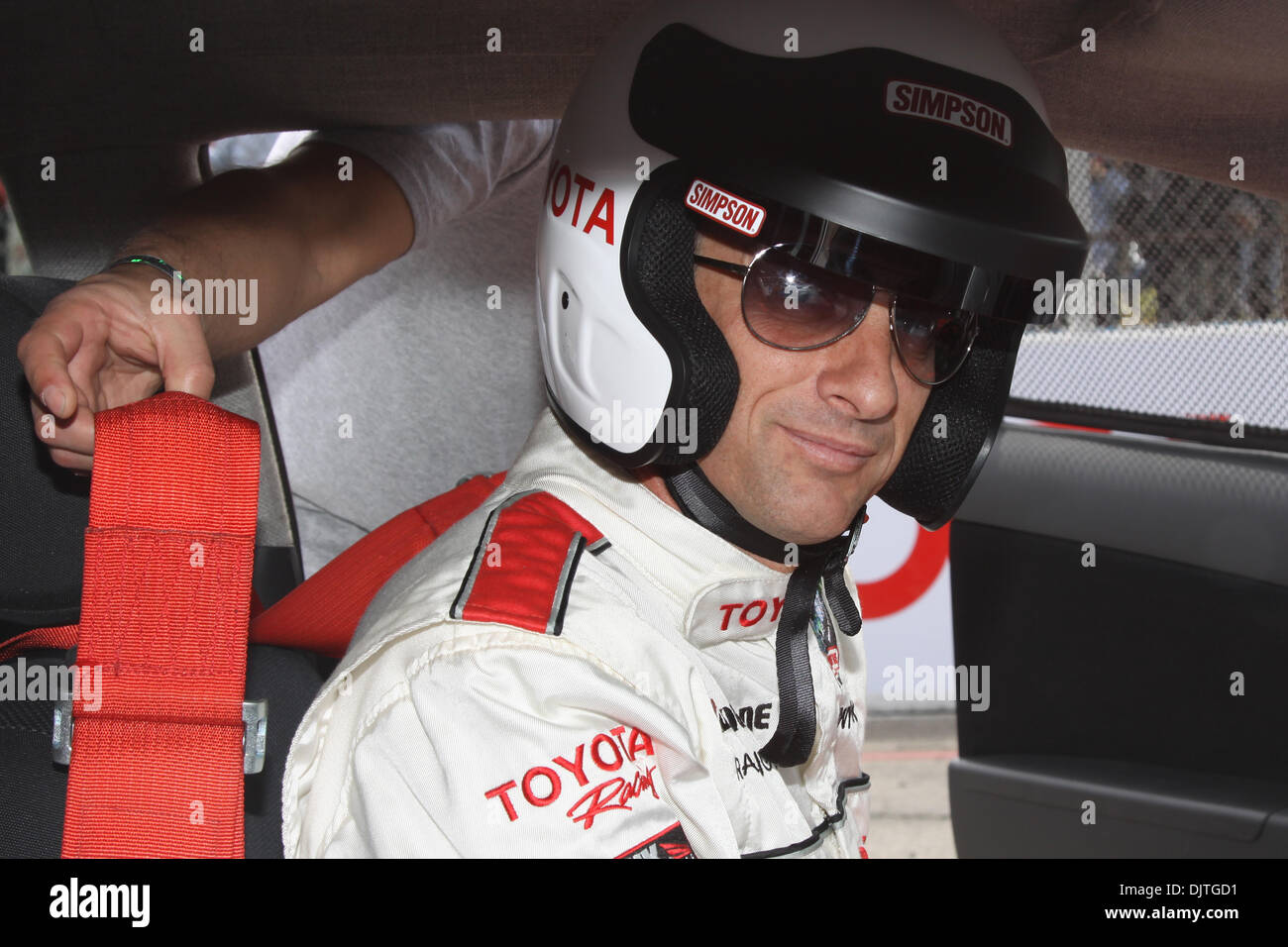 Tony Hawk gets buckled up before the Toyota celebrity race at the ...