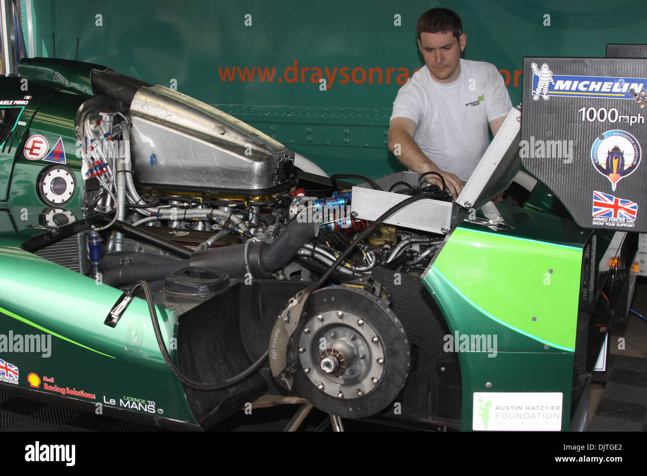 A crew member for the number 8 Drayson racing team prepares the Lola ...
