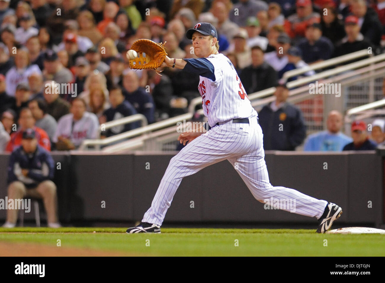 Minnesota Twins first baseman Justin Morneau #33 catches for an out in ...