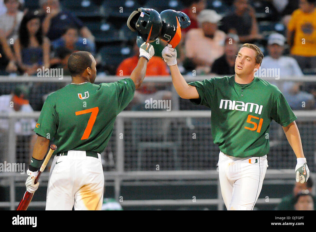 Miami Hurricanes 1B Ryan Perry (51) gets congratulated by .OF Zeke ...