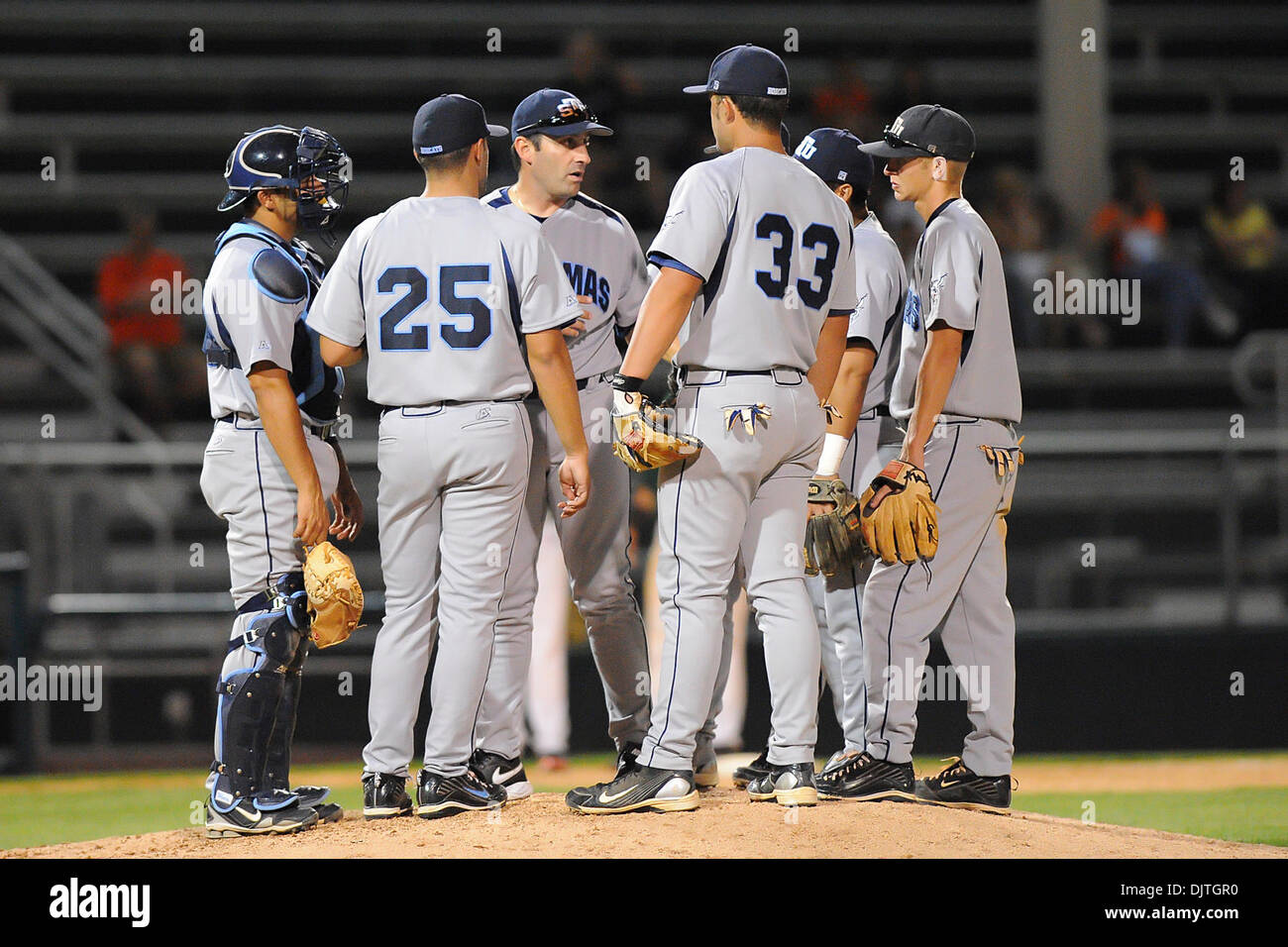 St. Thomas University Bobcats players meet at mound..The 14th ranked ...