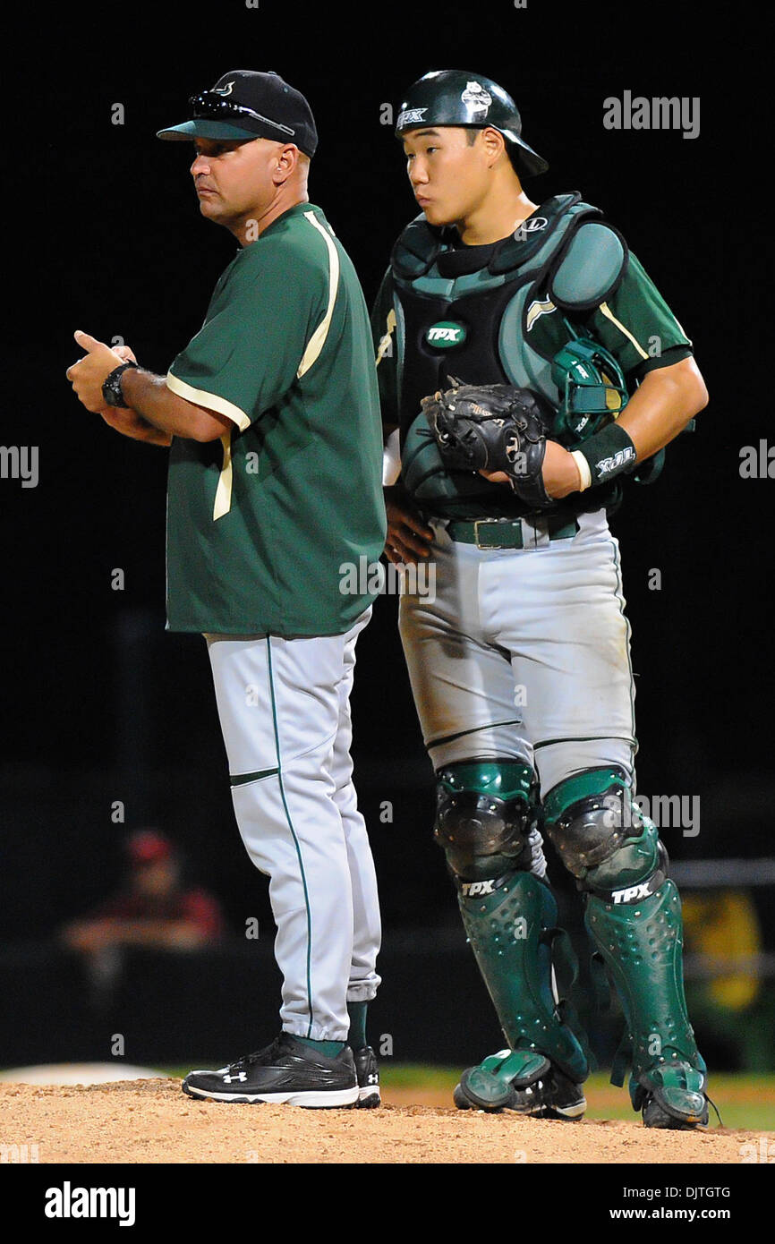 South Florida Bulls coach Lazer Collazo makes pitching change as C Eric ...