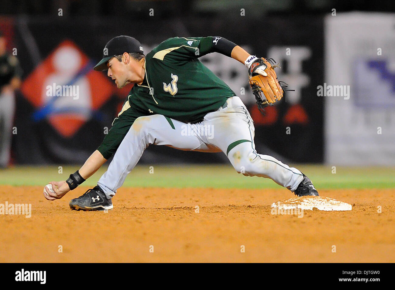 South Florida Bulls INF Luis Llerena (2) barehands throw from shortstop ...
