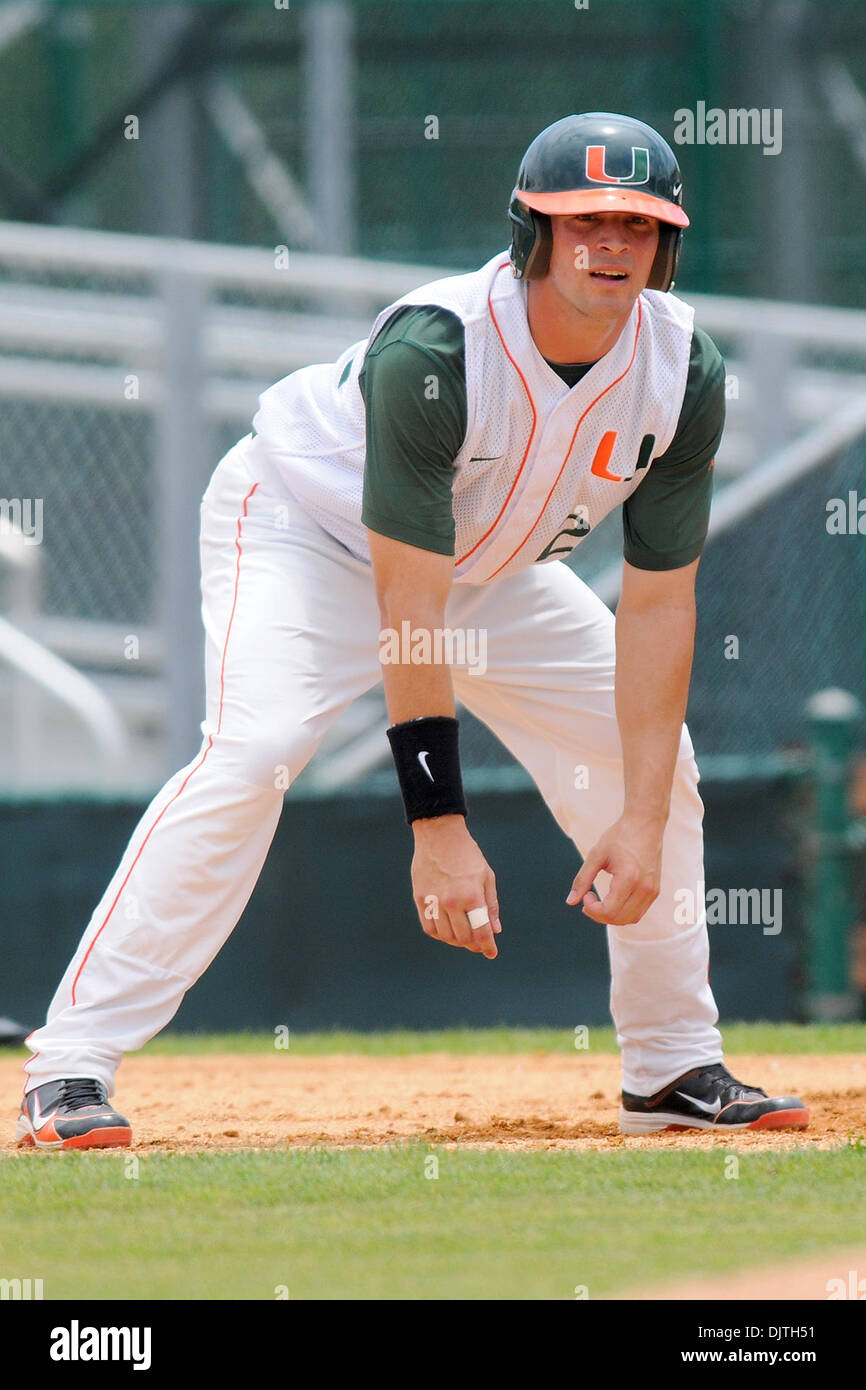 Miami Hurricanes OF Chris Pelaez (22) takes a lead off first base. The ...