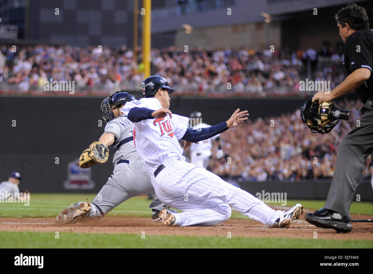 Minnesota Twins shortstop Trevor Plouffe #24 scores on a fielder's ...