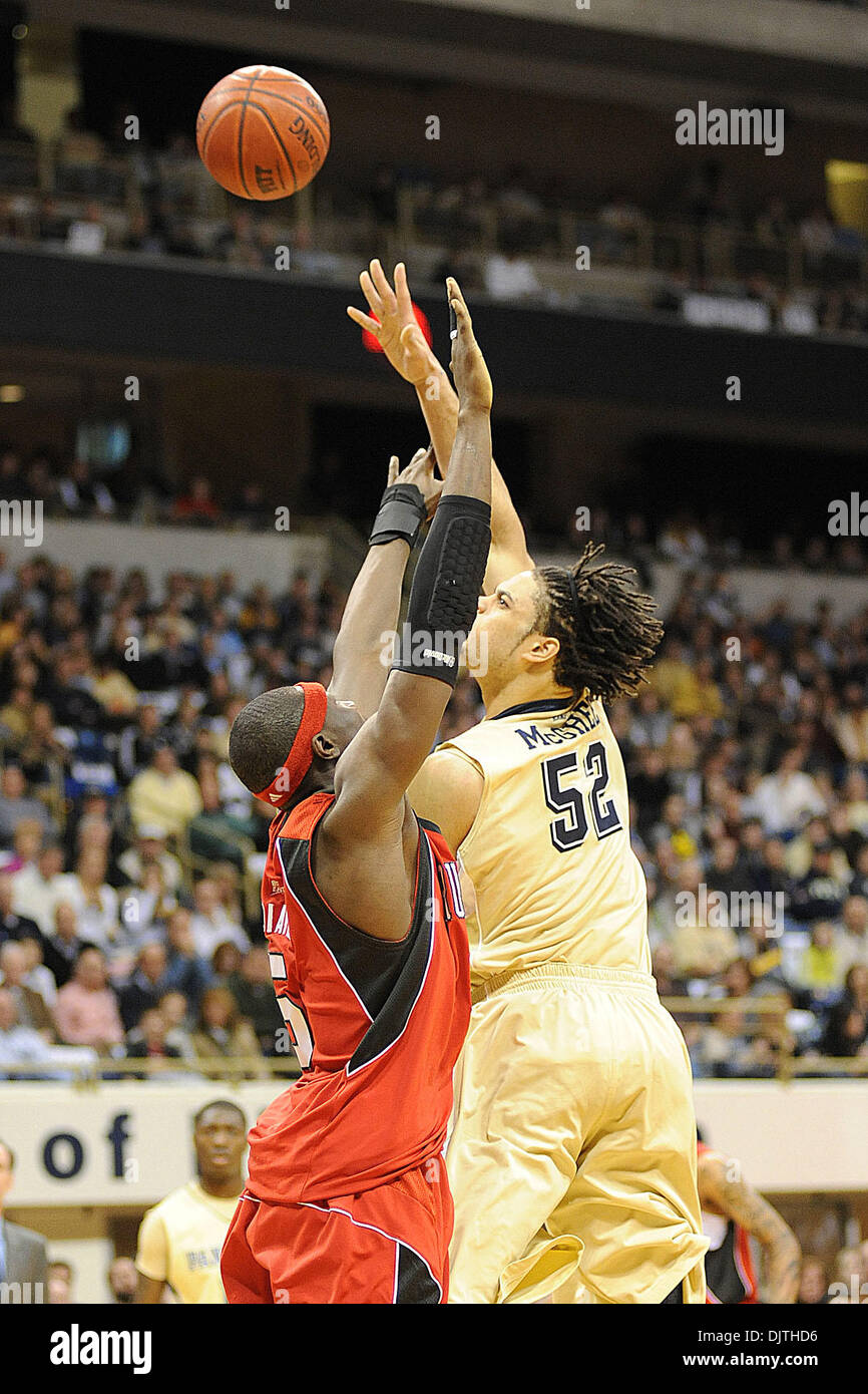 Pitts #52 Gary McGhee shoots over Rutgers #5 Hamady Ndiaye in 2nd half ...
