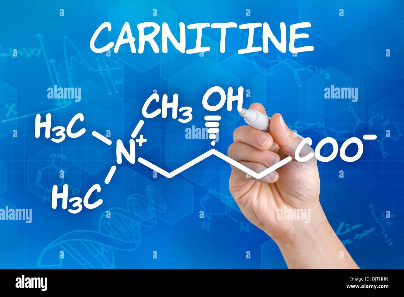 Hand with pen drawing the chemical formula of carnitine Stock Photo - Alamy
