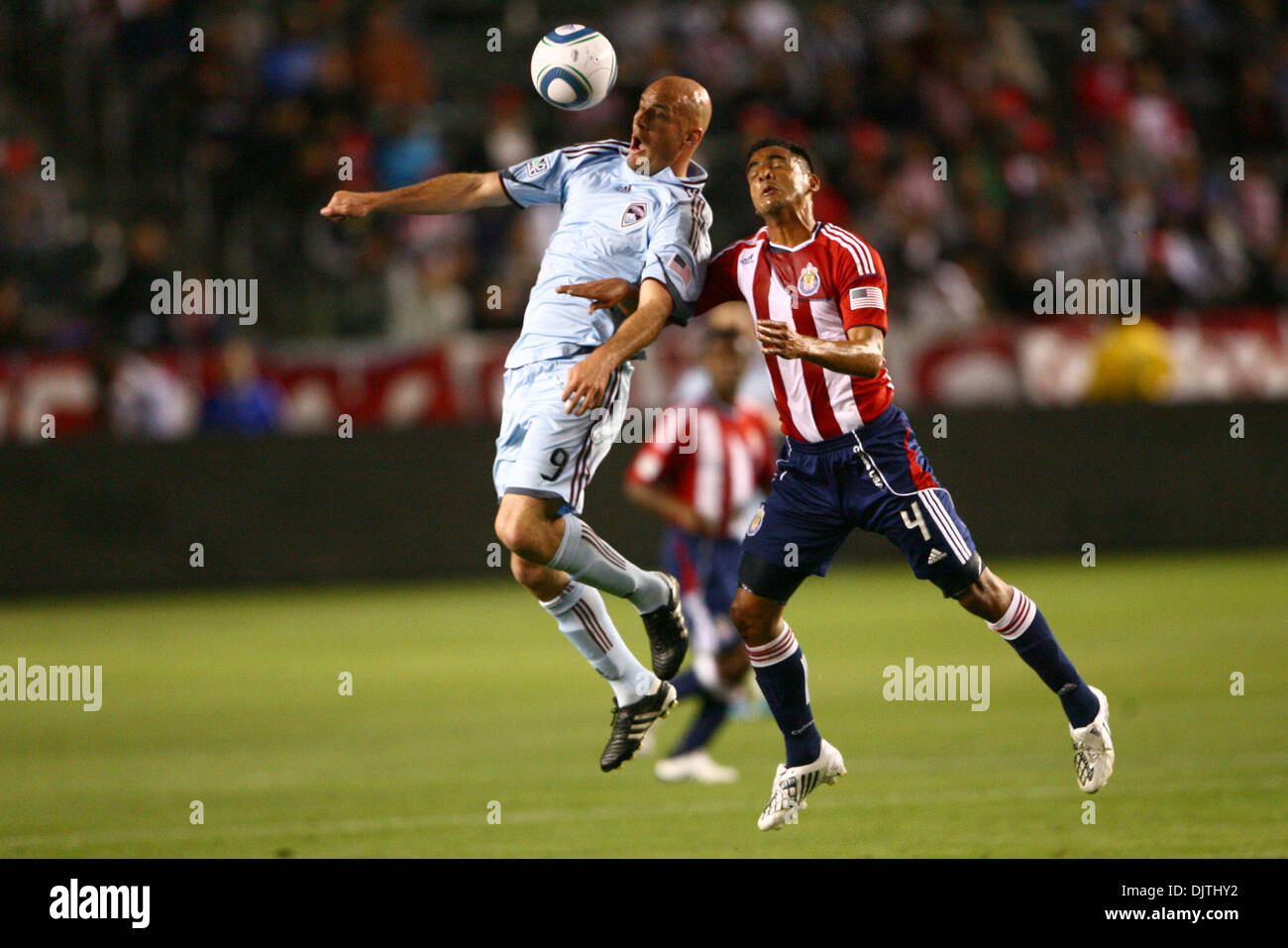Colorado Rapids Forward Conor Casey battles against Chivas defenseman ...