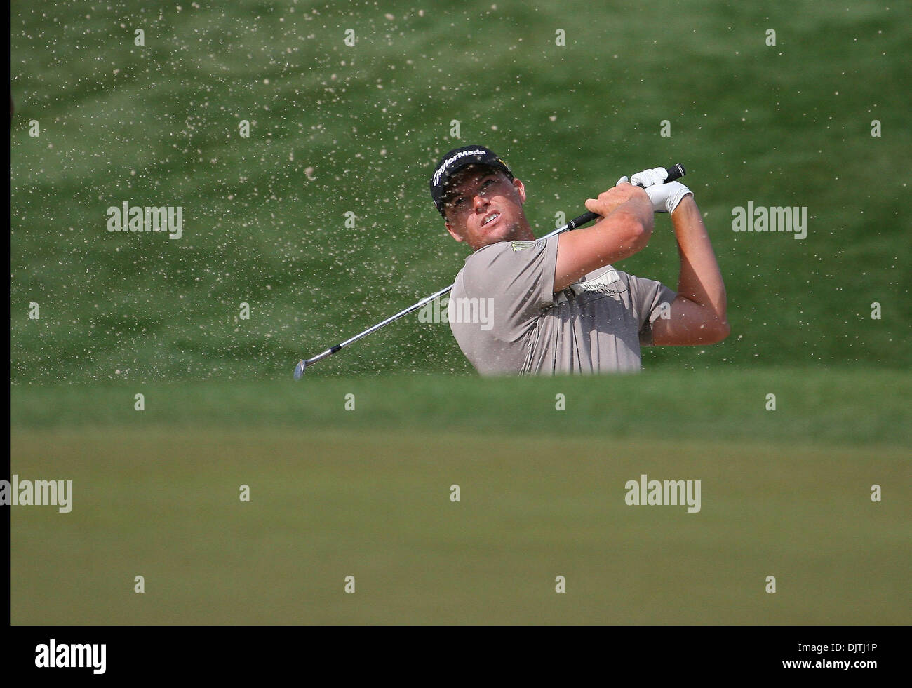 John Mallinger comes out of the bunker on the 12th hole. Shell Houston ...