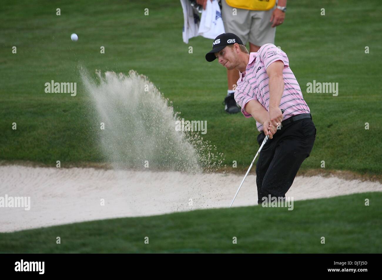 Chris Stroud of Houston, TX gets out of the sand trap on the 8th hole ...