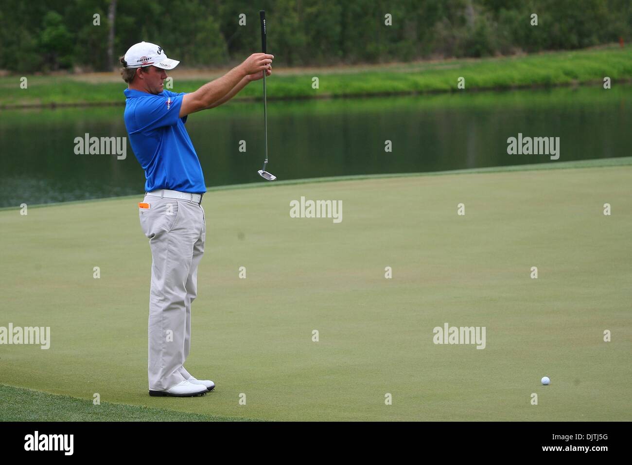 Nicholas Thompson uses his putter to help him read the 8th green. Shell ...
