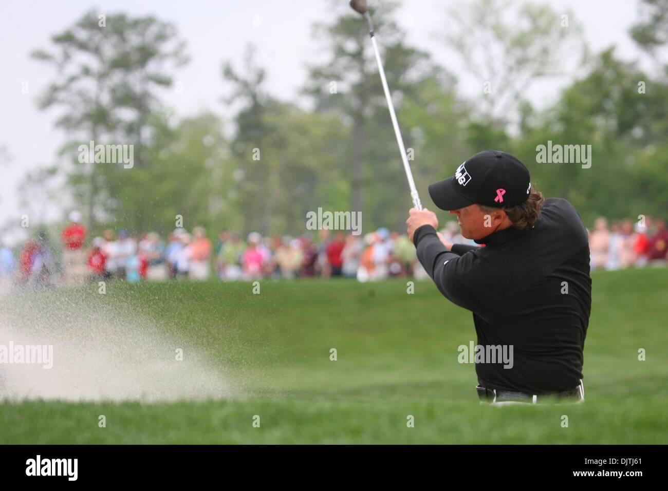 Phil Mickelson gets out of the sand trap on the 8th hole. Shell Houston ...