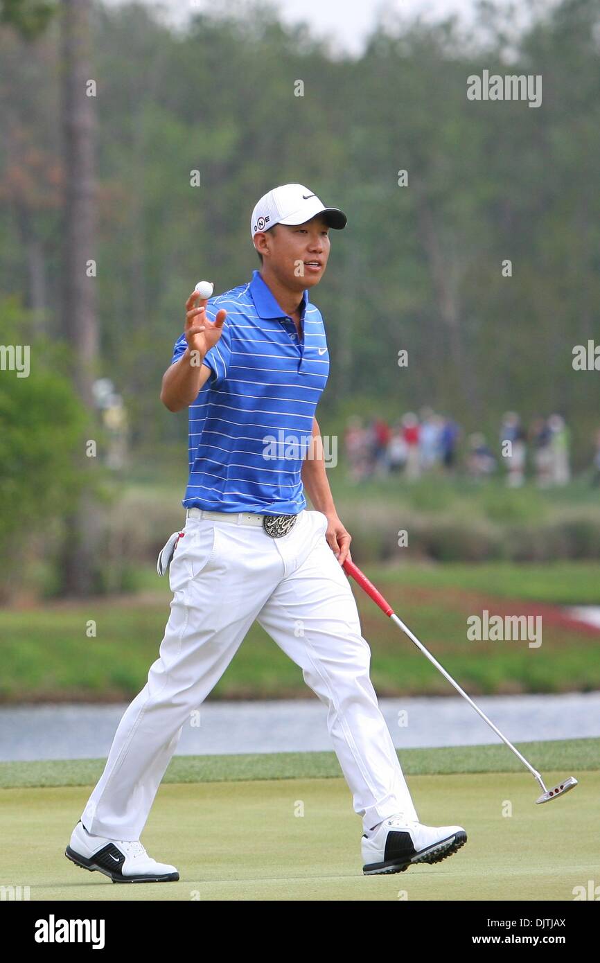 Anthony Kim salutes the crowd after sinking his putt for par on the 4th ...