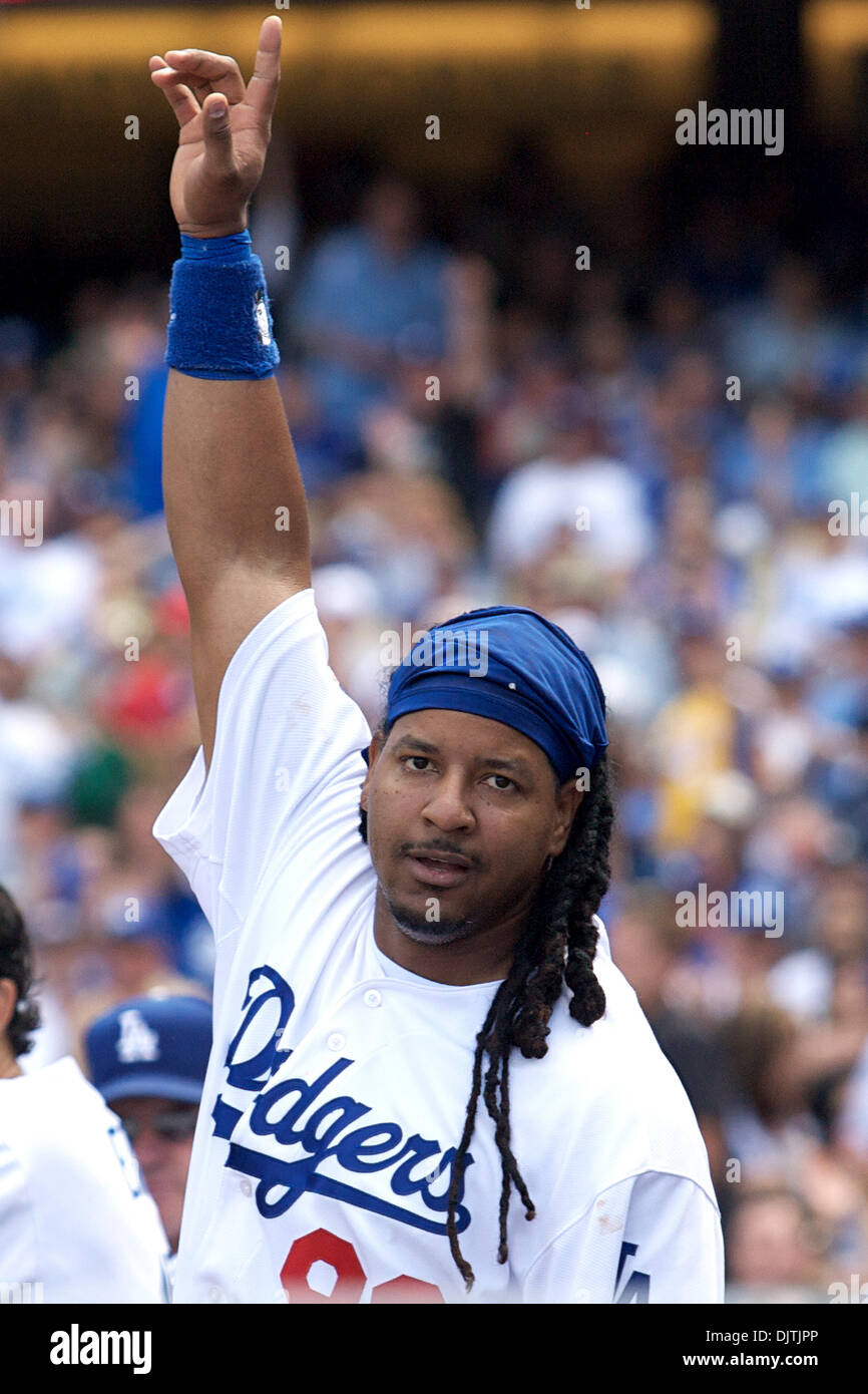 Manny Ramirez acknowledges the crowd ovation after hitting a home run ...