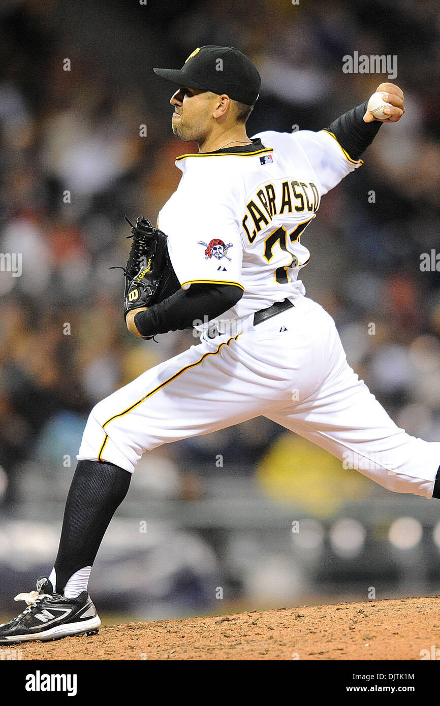 Pirates relief pitcher Carrasco (77) goes over the top with a pitch in ...