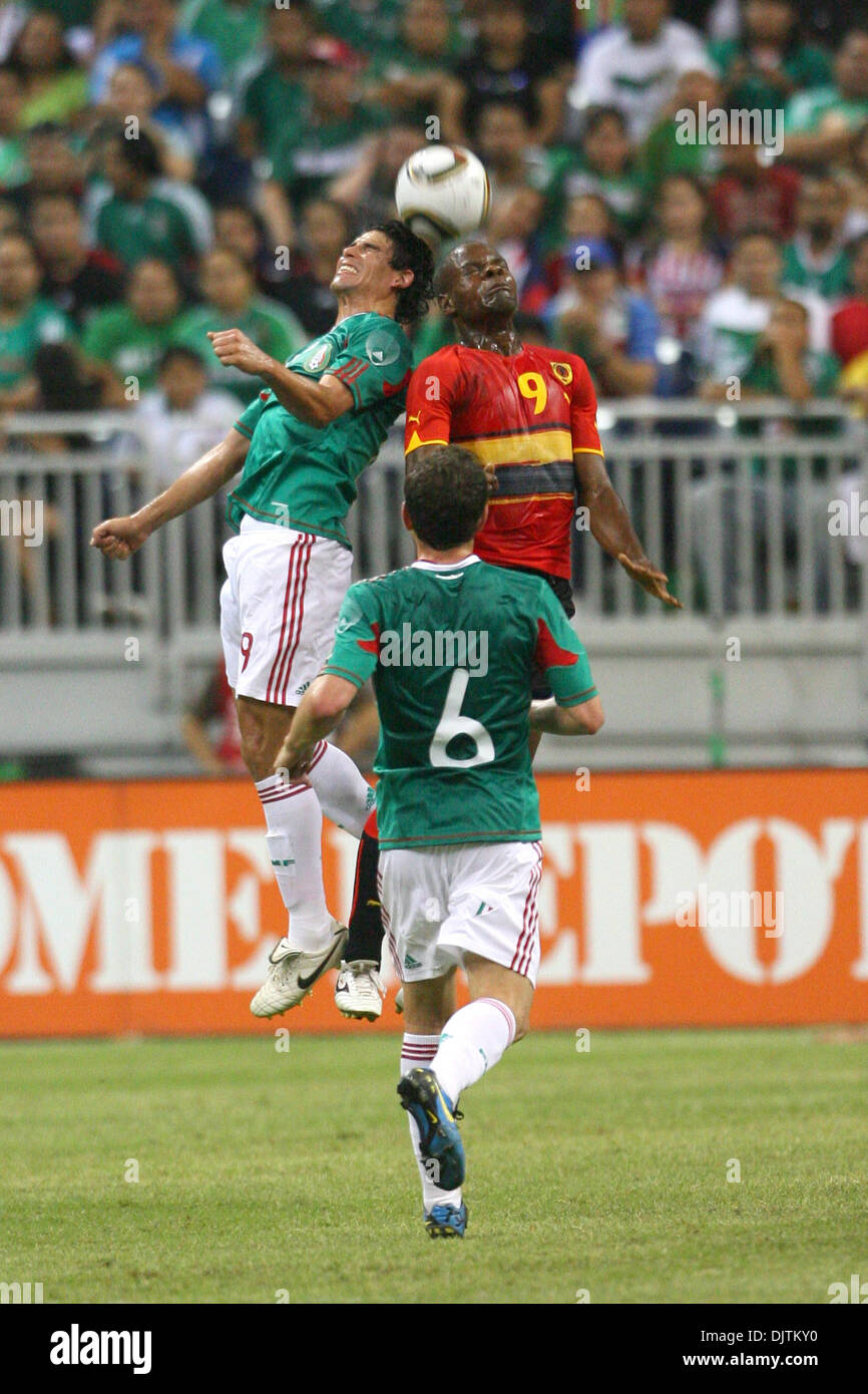Jonny Magallon (#19) Defender for Mexico gets up abit higher than Rasca ...