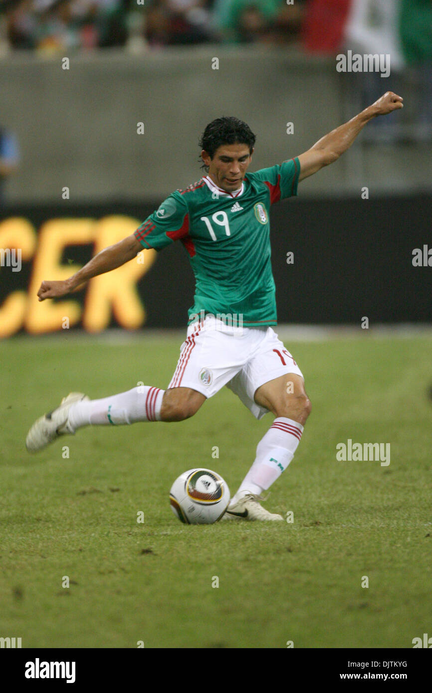 Jonny Magallon (#19) Defender for Mexico clears the ball to his ...
