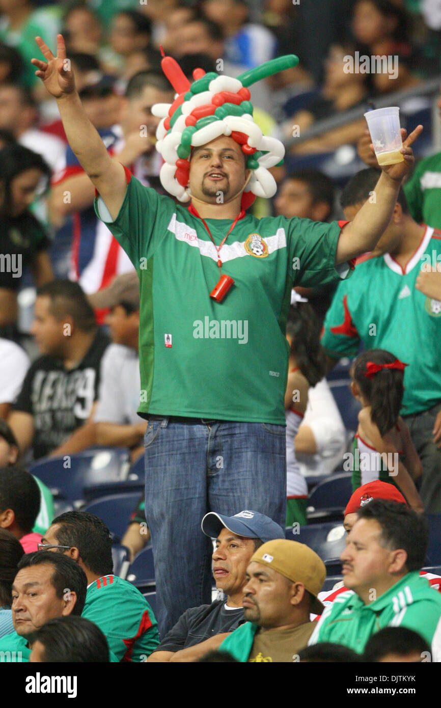Mexico fan shows off his colors in his head gear. Mexico defeated ...