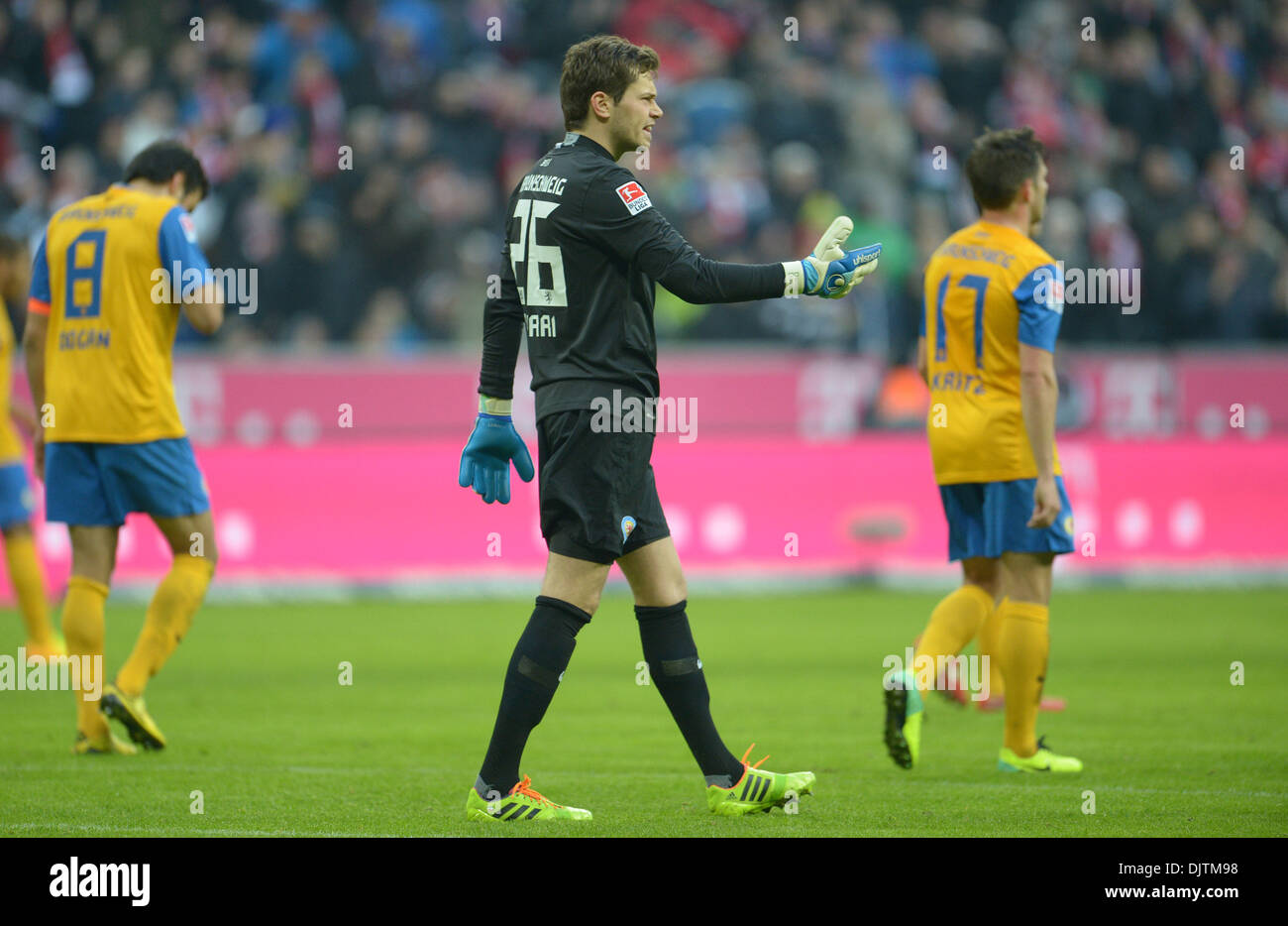 Munich, Germany. 30th Nov, 2013. Braunschweig's Deniz Dogan (L ...